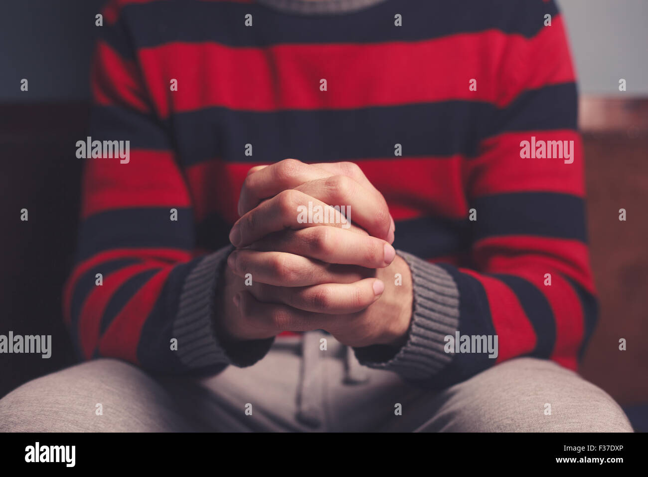 Man praying folded hands hi-res stock photography and images - Alamy