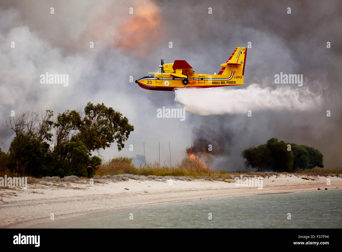 Firefighting aircraft dousing forest fire over Sardinia Stock Photo - Alamy