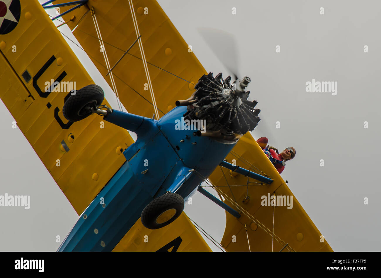 Emma Stewart Rigby wing walking atop a Boeing Stearman plane operated ...