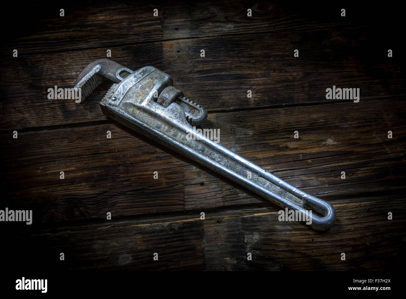 A close up of an old weathered pipe wrench Stock Photo - Alamy