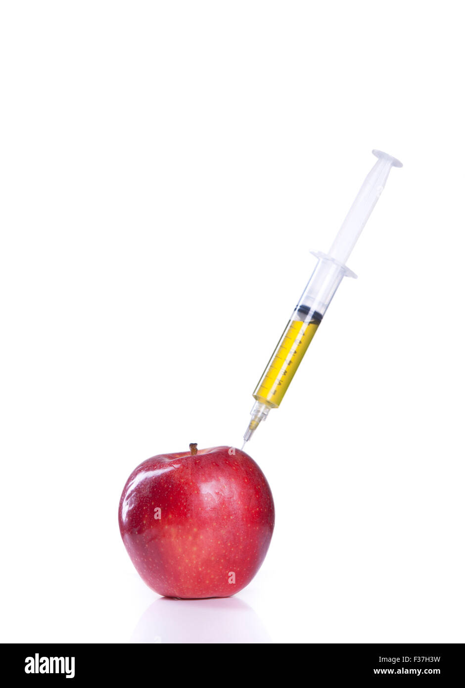 Injecting an apple Stock Photo - Alamy