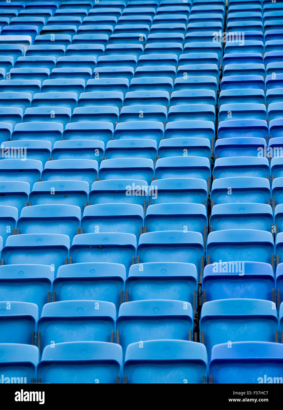 Blue Stadium chairs in a row creating a nice abstract Stock Photo - Alamy