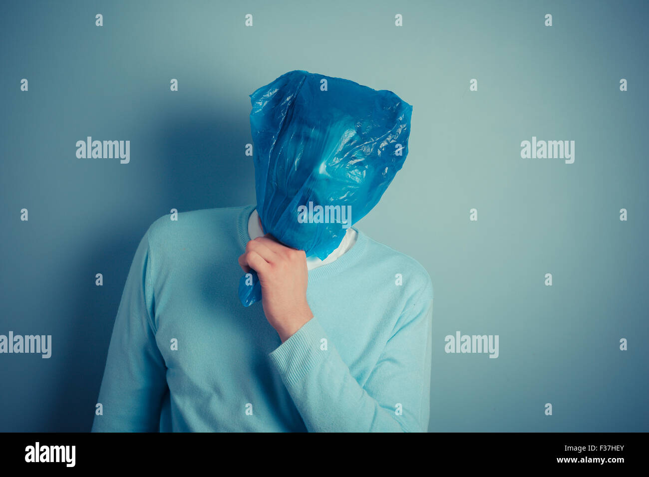 A man with a plastic bag over his head is suffocating Stock Photo - Alamy