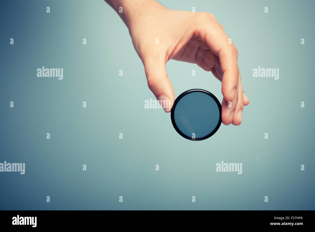 A hand is holding circular polarizer filter Stock Photo - Alamy