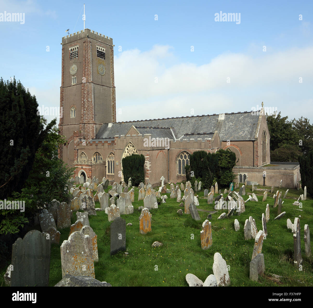St. Mary's Church, Brixham, Devon, England, UK. Gravestones can be seen ...