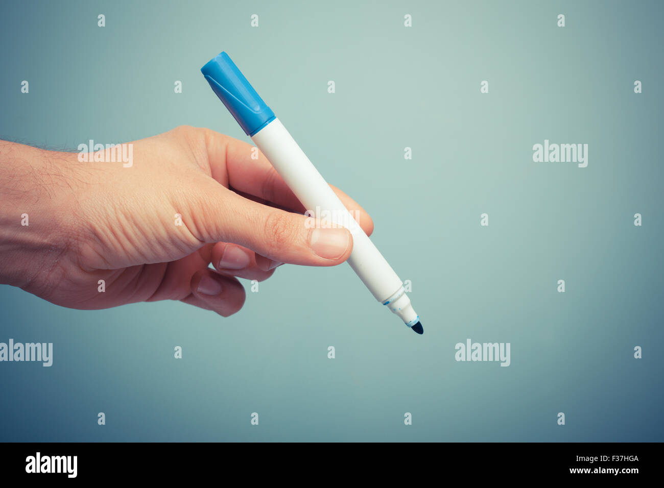 Human hand holding marker drawing hi-res stock photography and images ...