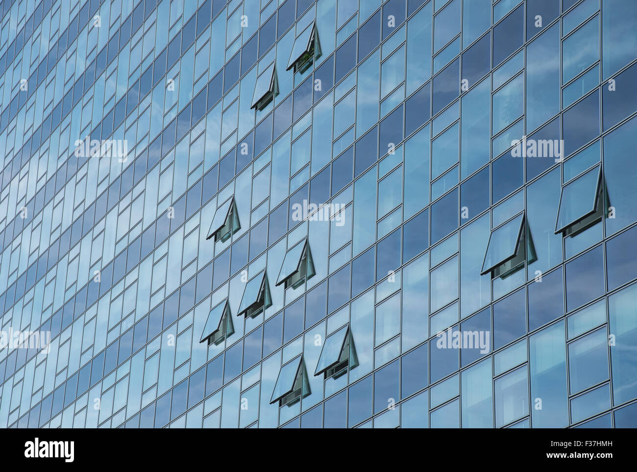 Architectural detail of a modern blue glass skyscraper building with ...