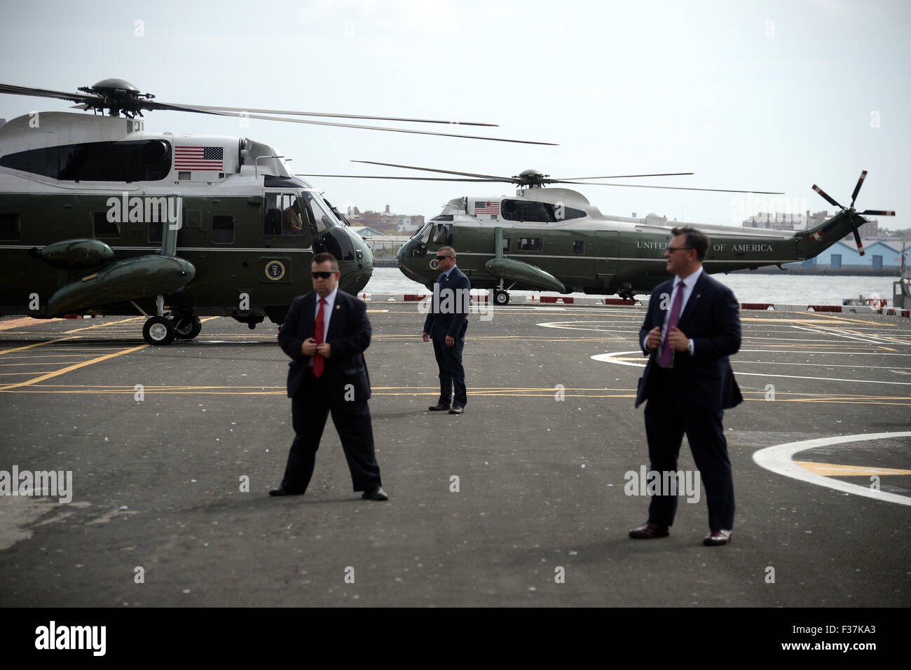 Security detail guard stand near Marine One (on left) carrying United ...