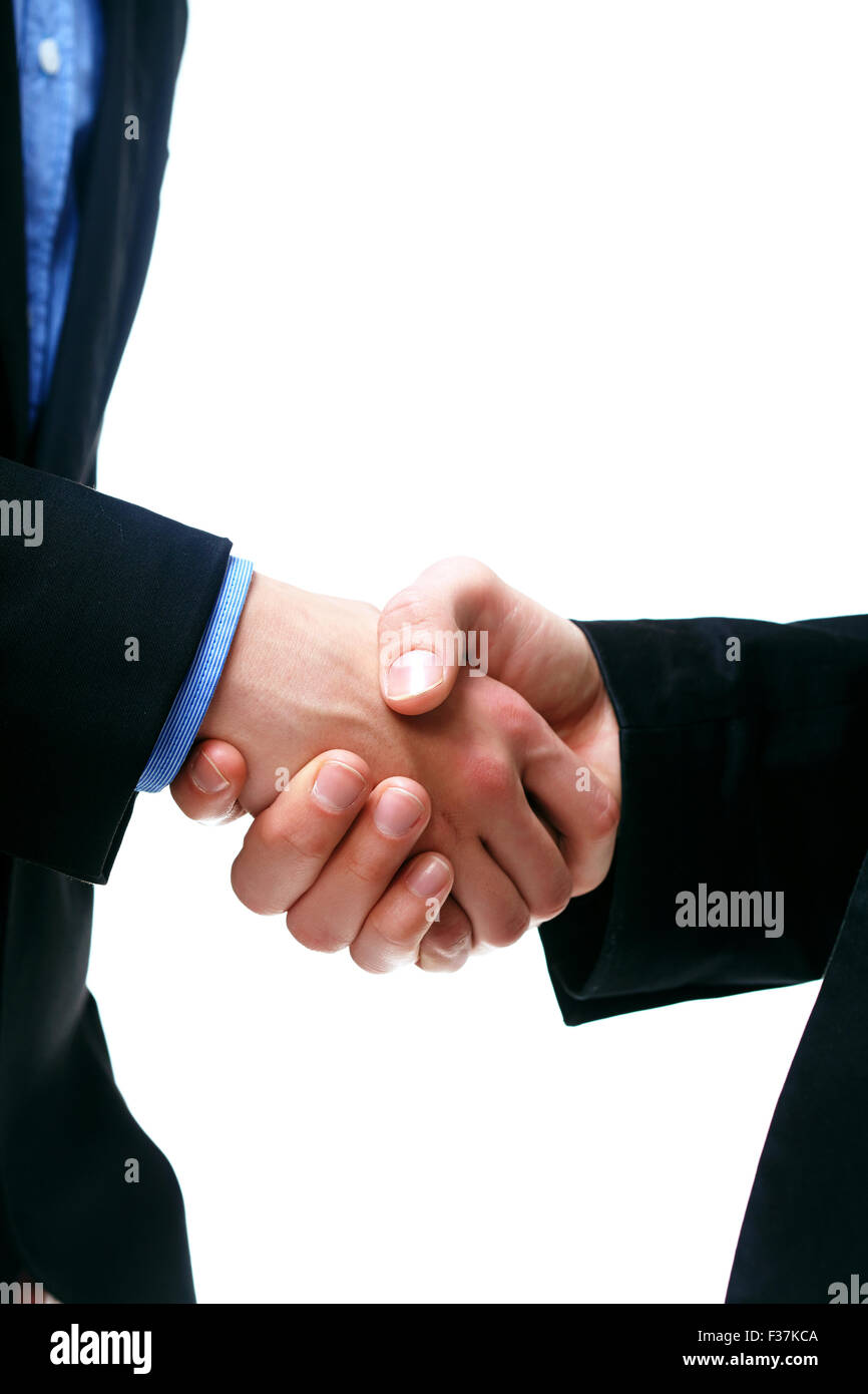 two young business executives shaking hands close-up Stock Photo - Alamy