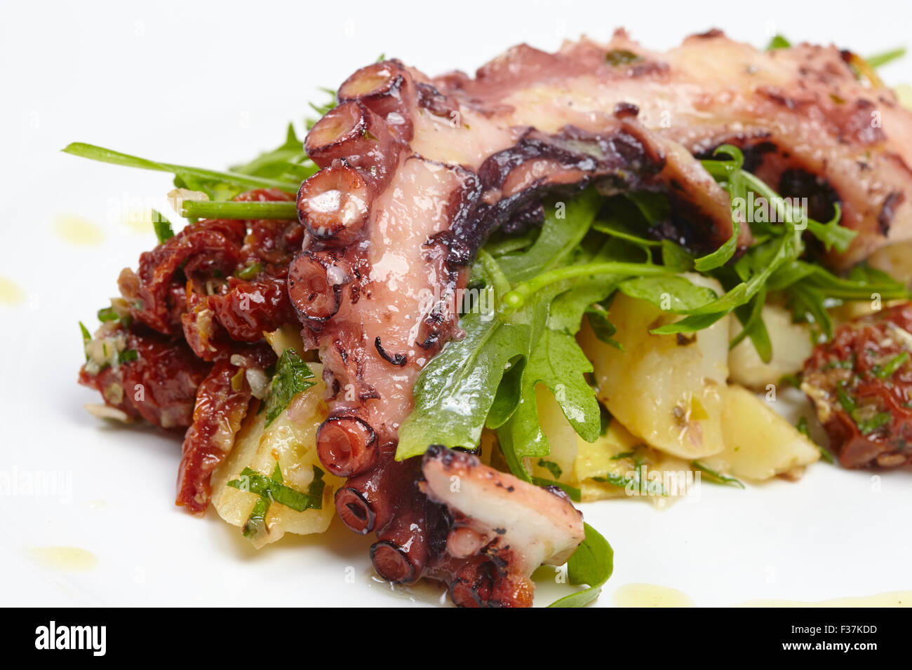 octopus with potatoes, arugula Stock Photo - Alamy