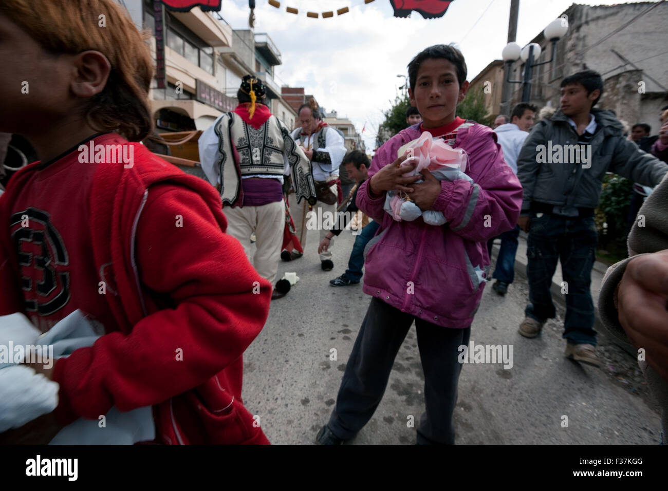 Portrait of a gypsy kid with a handful of coloured collection of ...