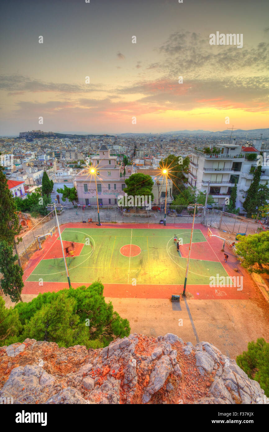 View of Athens and Acropolis from Strefi Hill. Basketball playground in ...