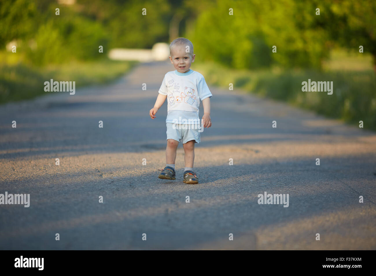boy run on the road Stock Photo - Alamy