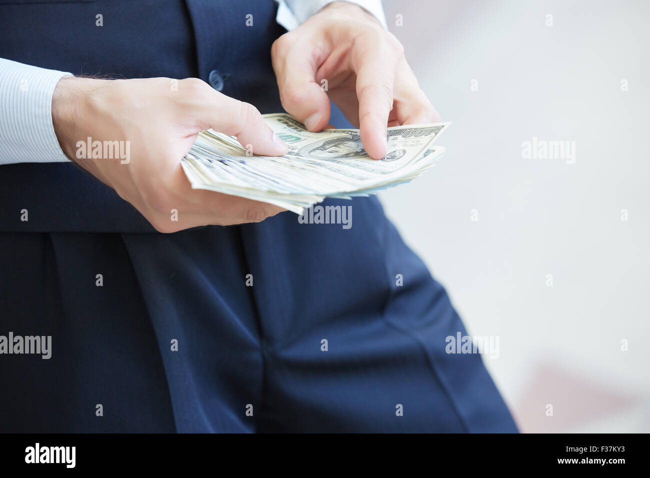 closeup money in male hands Stock Photo - Alamy