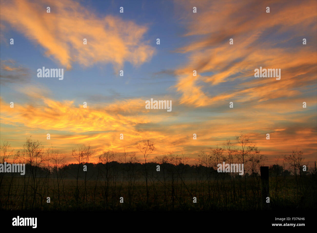 Colorful sunset along countryside in Indiana Stock Photo - Alamy
