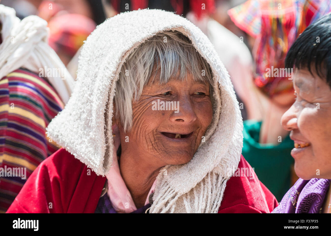 Bhutan, Paro - Festival of Masks. Two Bhutanese ladies talking whilst ...