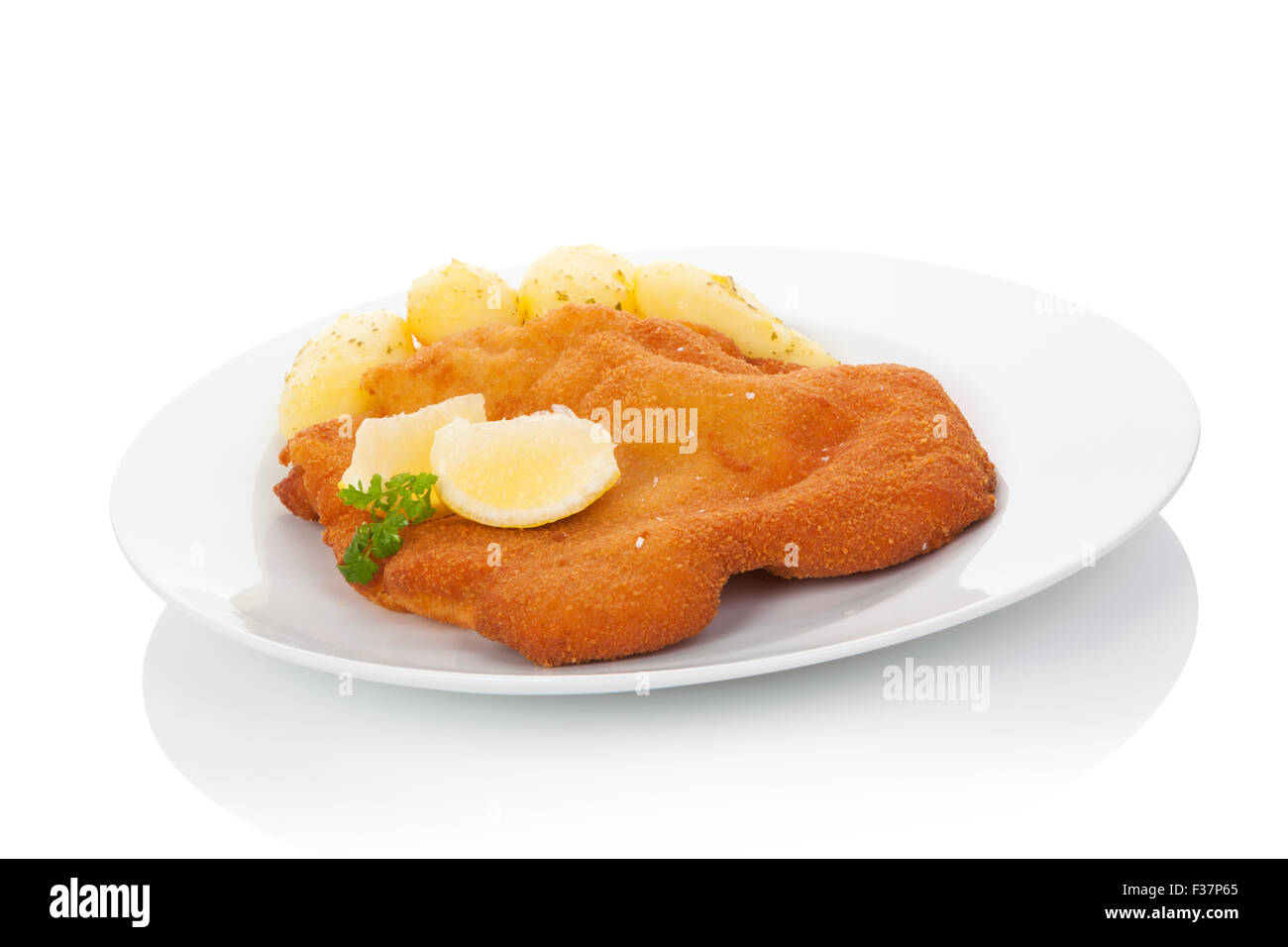 Delicious wiener schnitzel on plate isolated on white background with ...