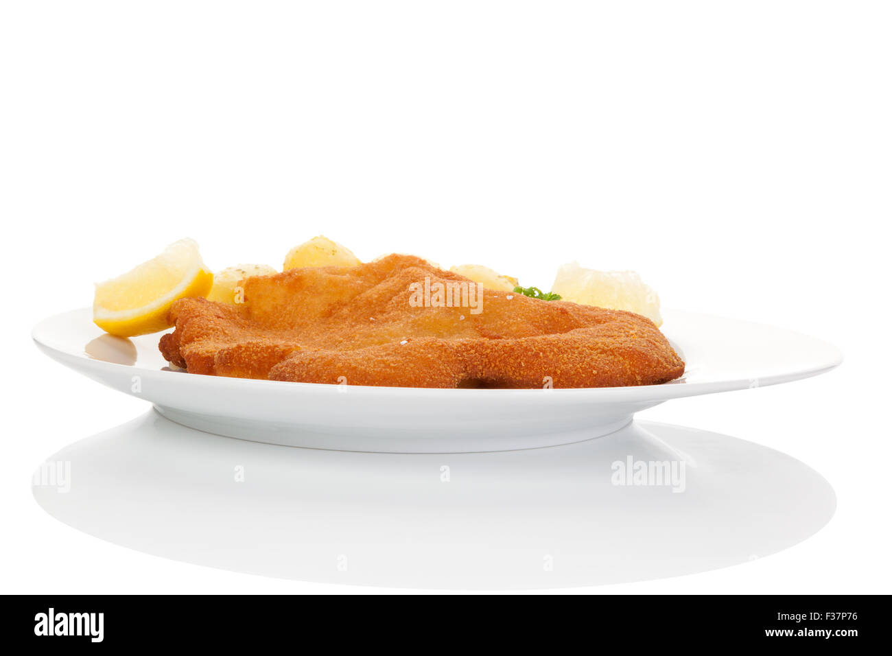 Delicious wiener schnitzel on plate isolated on white background with ...