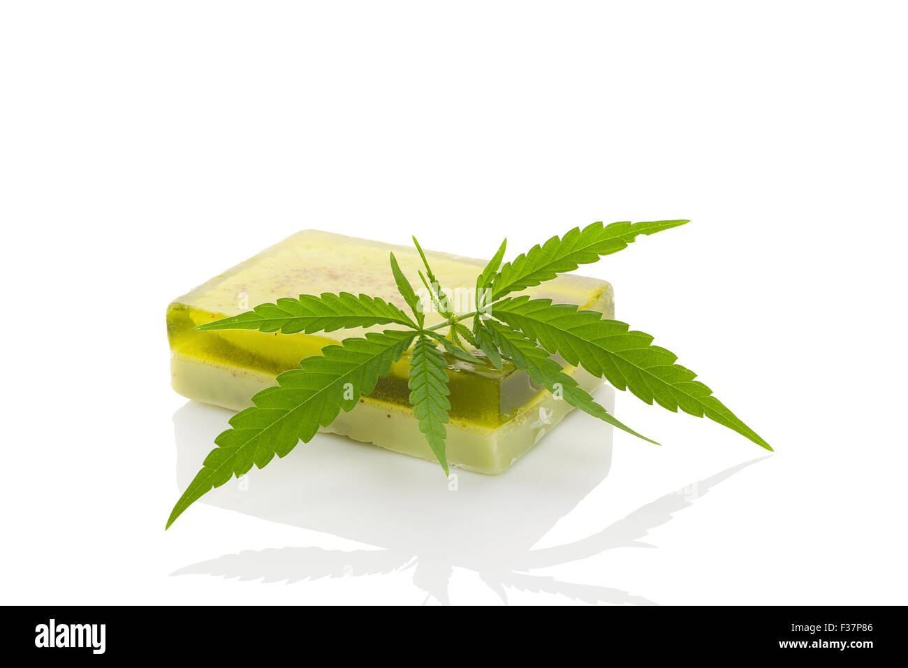 Green hemp soap and hemp leaf isolated on white background. Cannabis ... Green hemp soap and hemp leaf isolated on white background. Cannabis ...