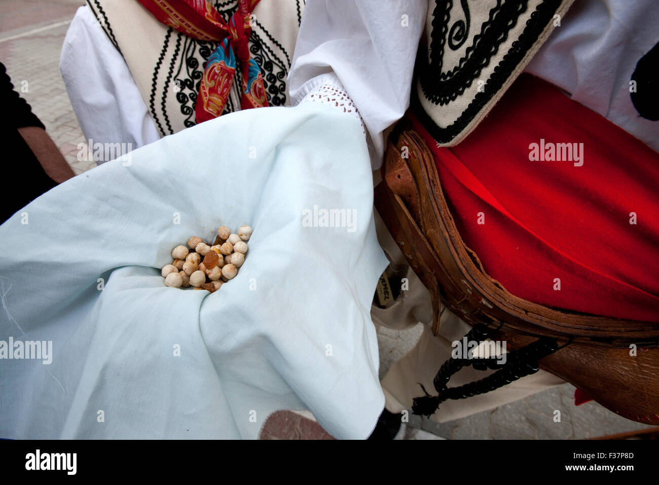 Vlach holds an opened bonbonniere containing roasted chick peas and ...