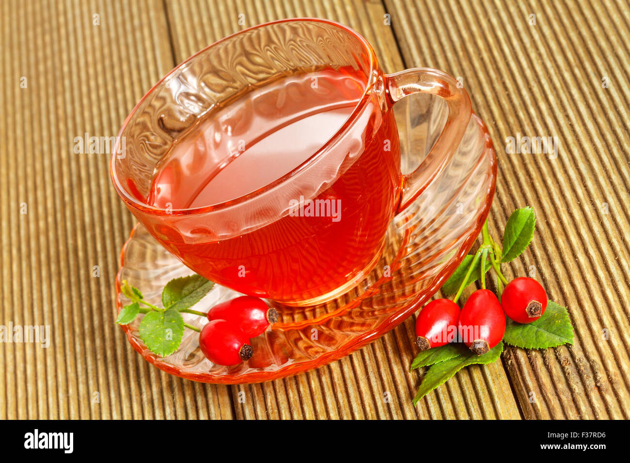 rose hip tea with fresh berries on the wooden background Stock Photo ...