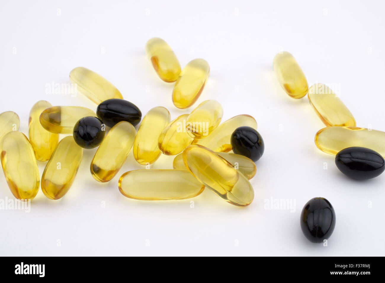 Fish oil and krill oil on white background Stock Photo - Alamy