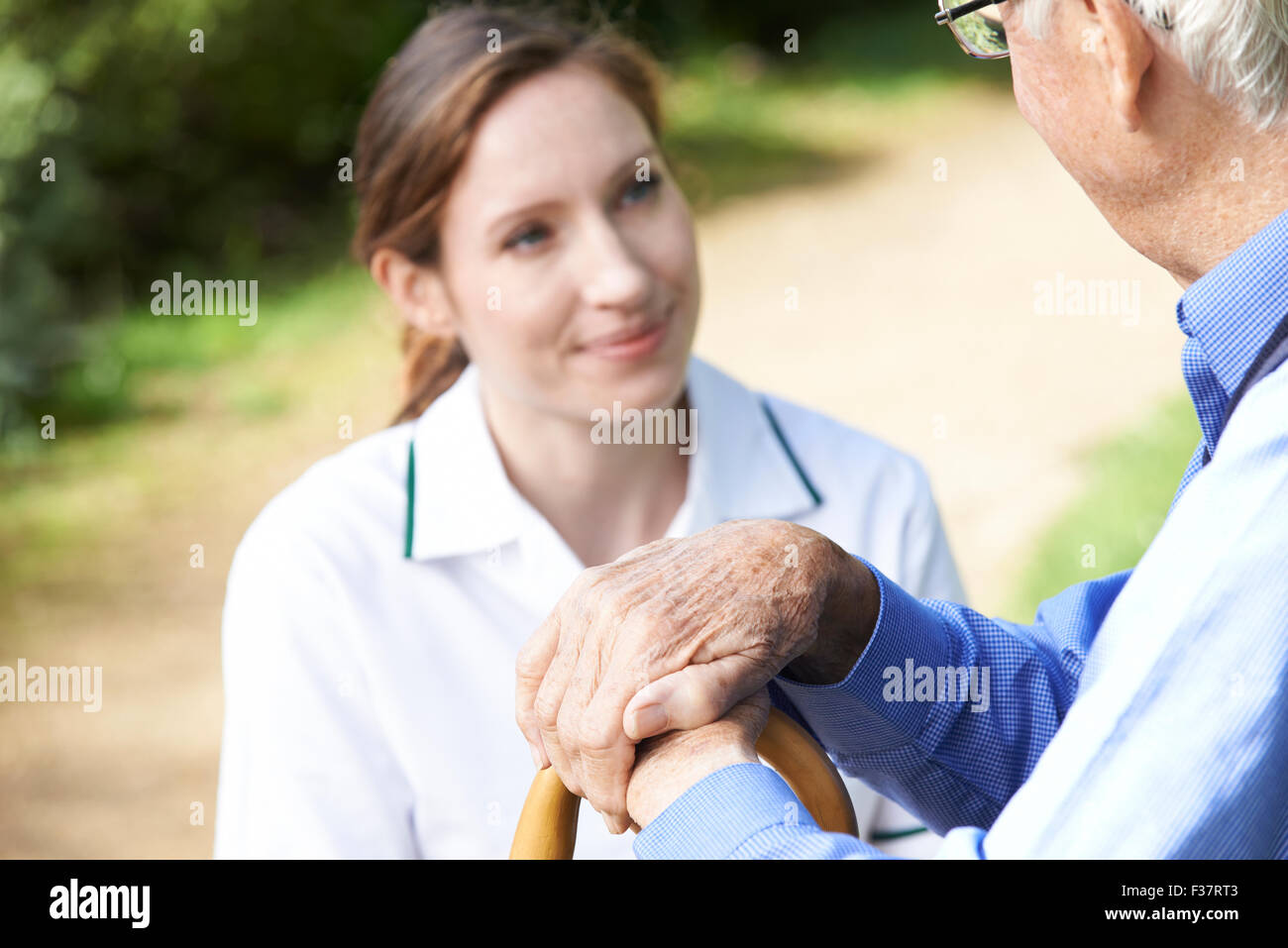 Helping hands care home dementia nurse hi-res stock photography and ...