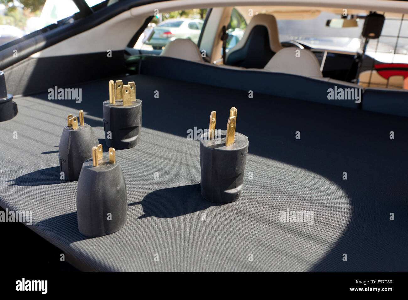 Power plug adapters for Tesla electric car - USA Stock Photo - Alamy