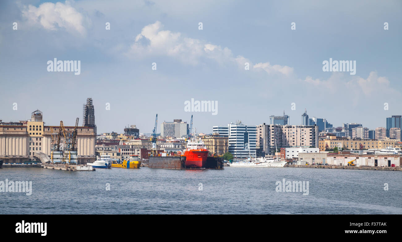 Port of Naples, coastal cityscape with cargo ships moored in the ...