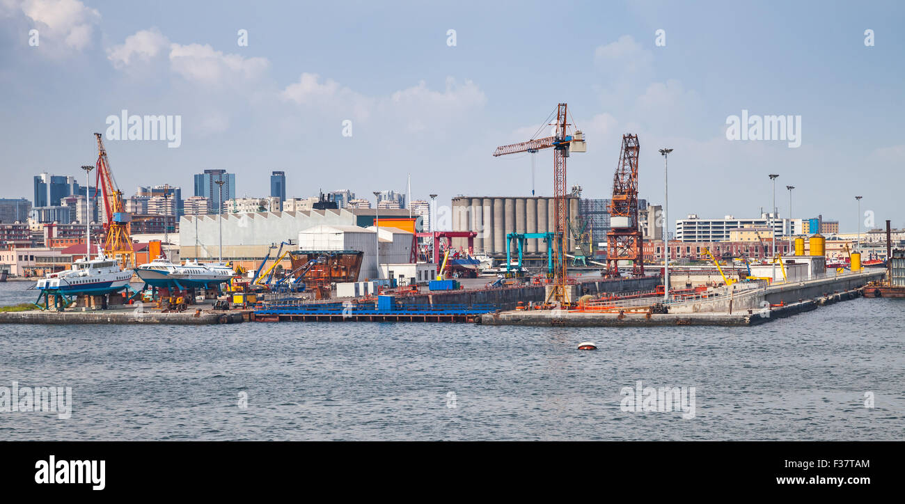 Port of Naples, coastal cityscape with shipyard dock Stock Photo - Alamy