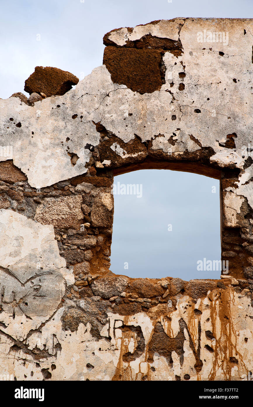 brown distorted door window in a broke paint wall arrecife lanzarote ...