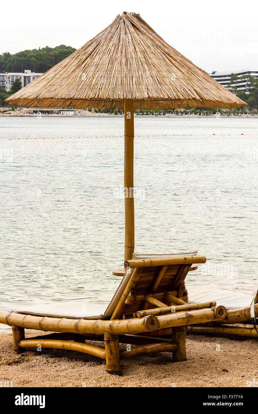 Beach chair and umbrella on sand beach. Concept for rest, relaxation ...
