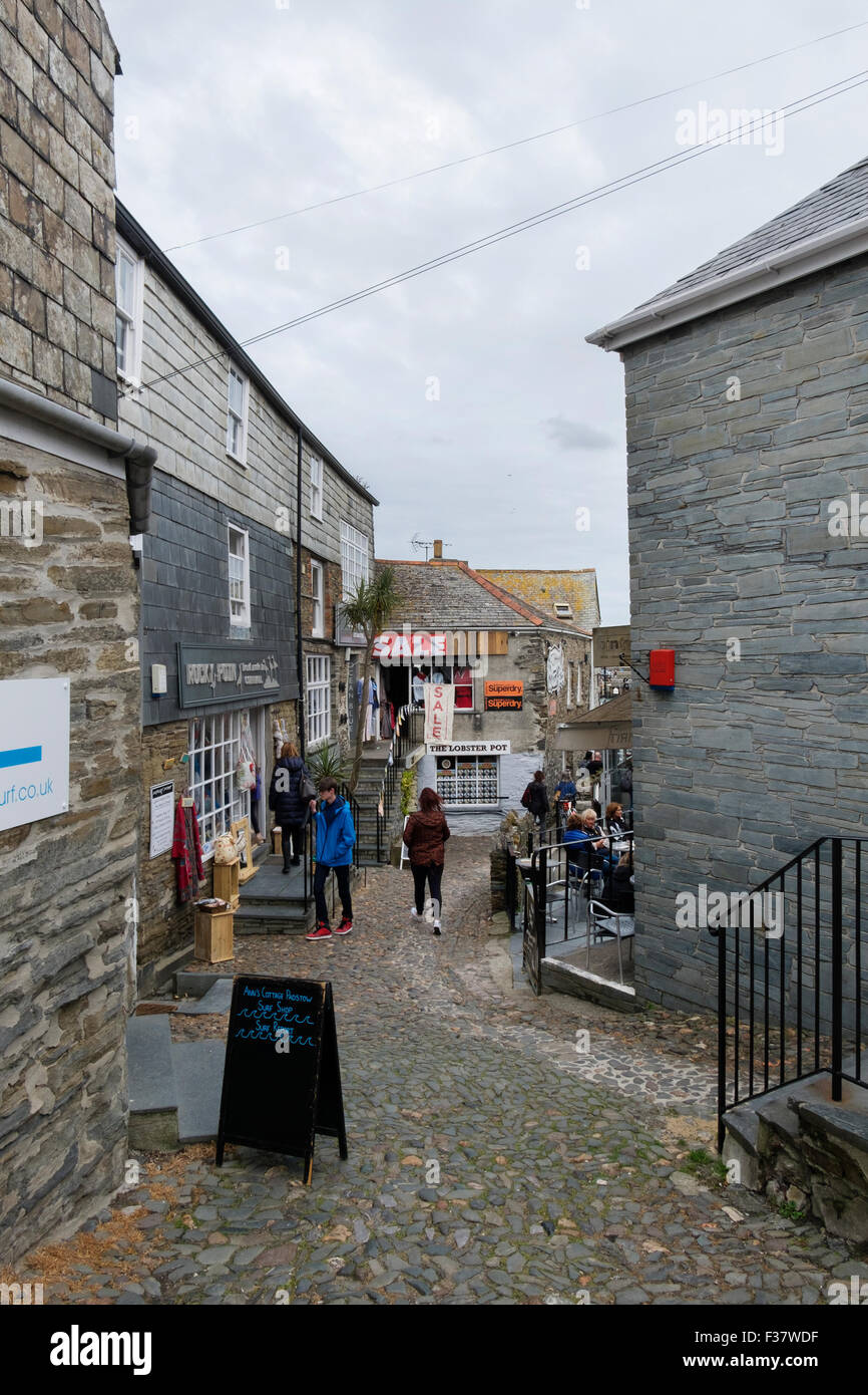 A narrow path leading to gifts and clothes shops Padstow Cornwall UK ...