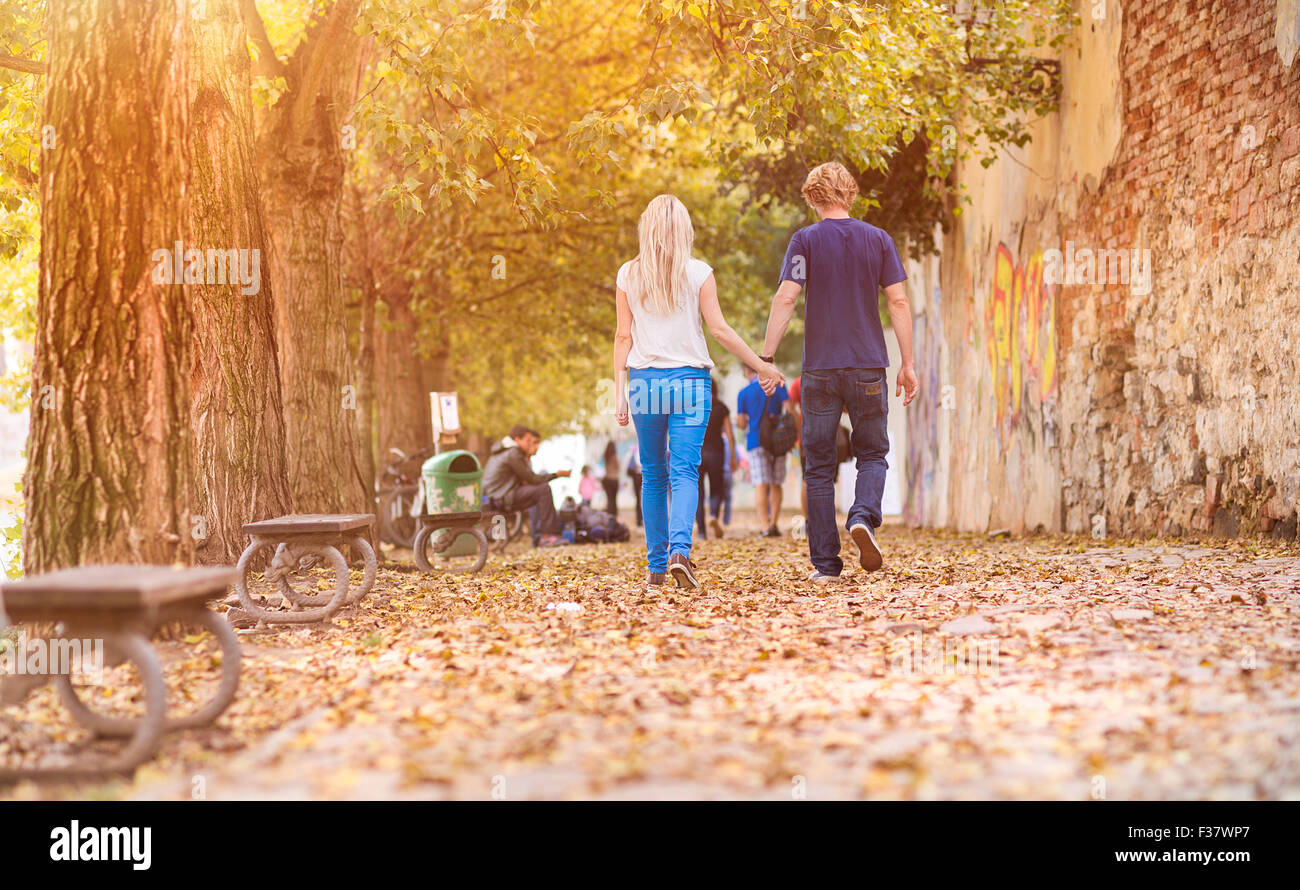 Young couple taking a walk Stock Photo - Alamy