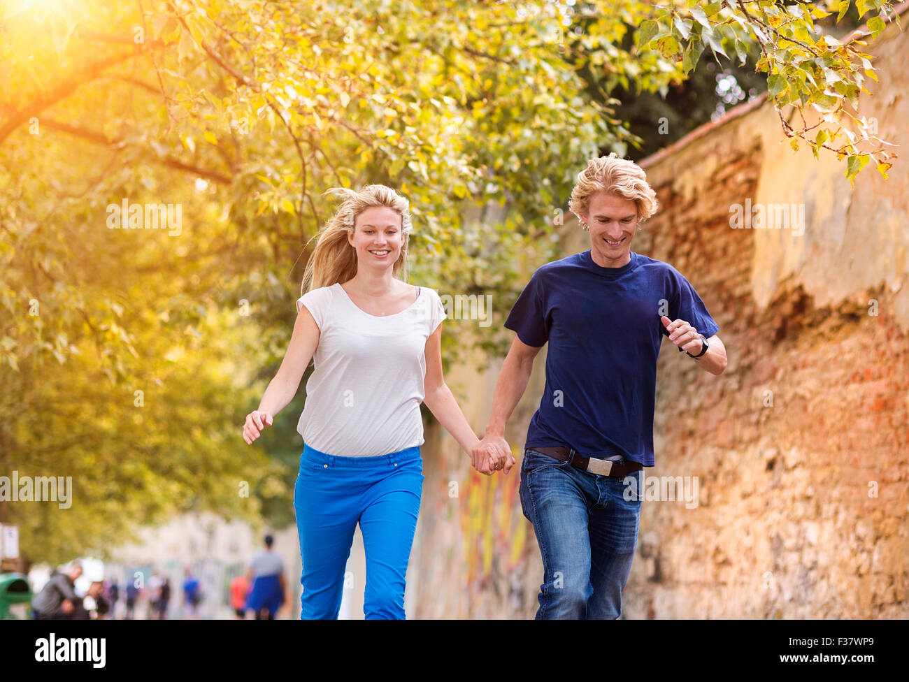 Young couple taking a walk Stock Photo - Alamy