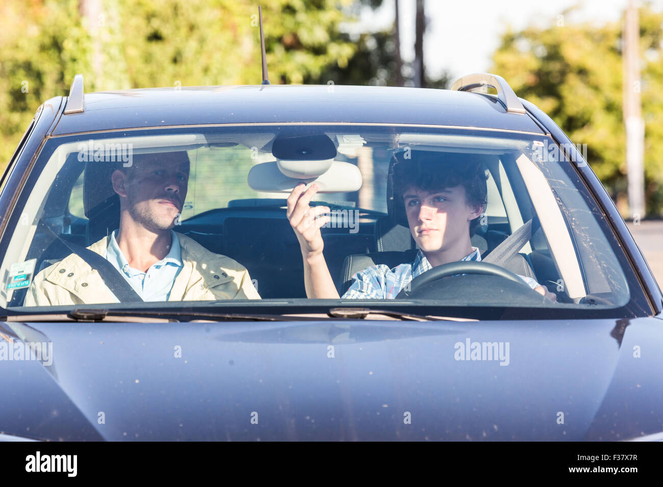 Teeange BOY learning how to drive with a driver instructor Stock Photo ...