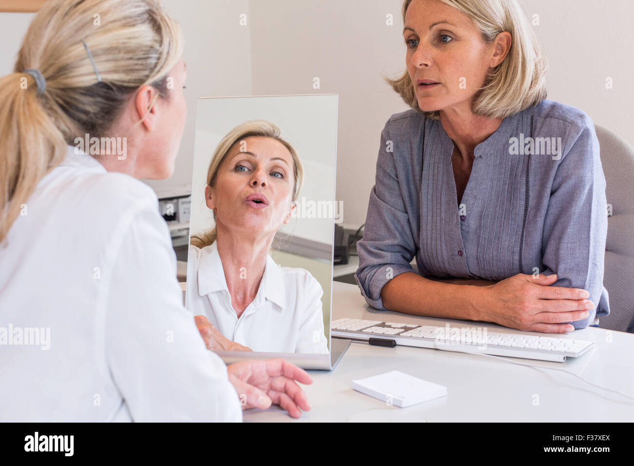 Treatment of stuttering : woman doing articulation and breathing ...