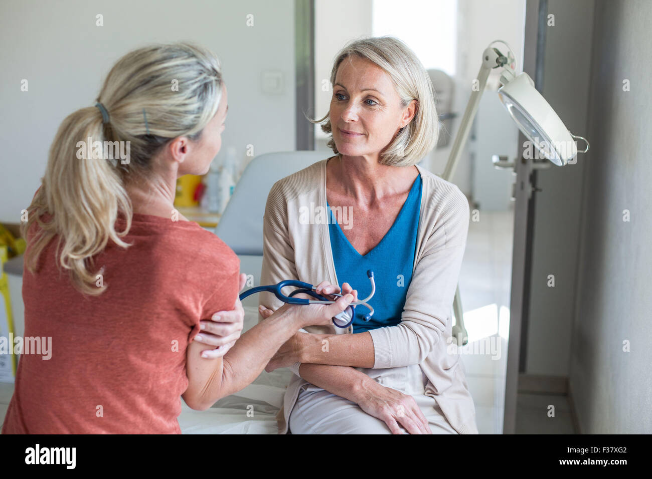 Female doctor female patient hi-res stock photography and images - Alamy