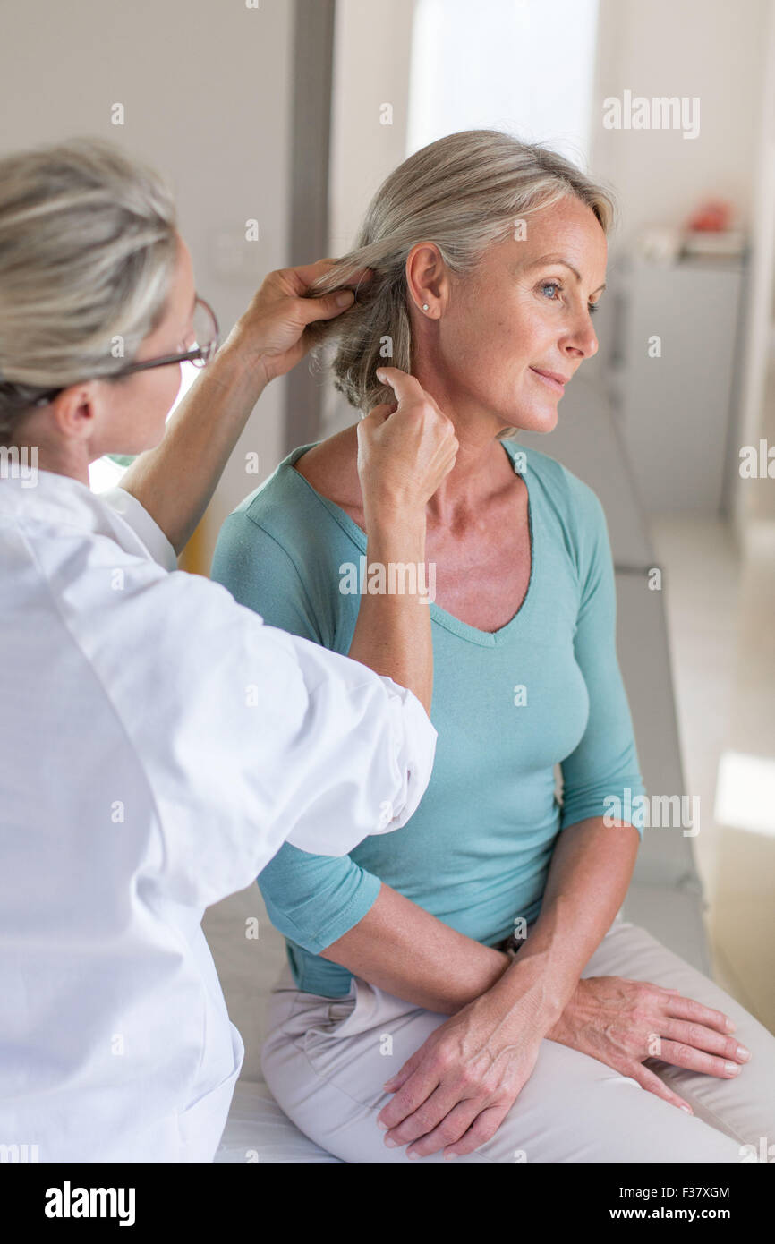 Examination of woman hair Stock Photo - Alamy