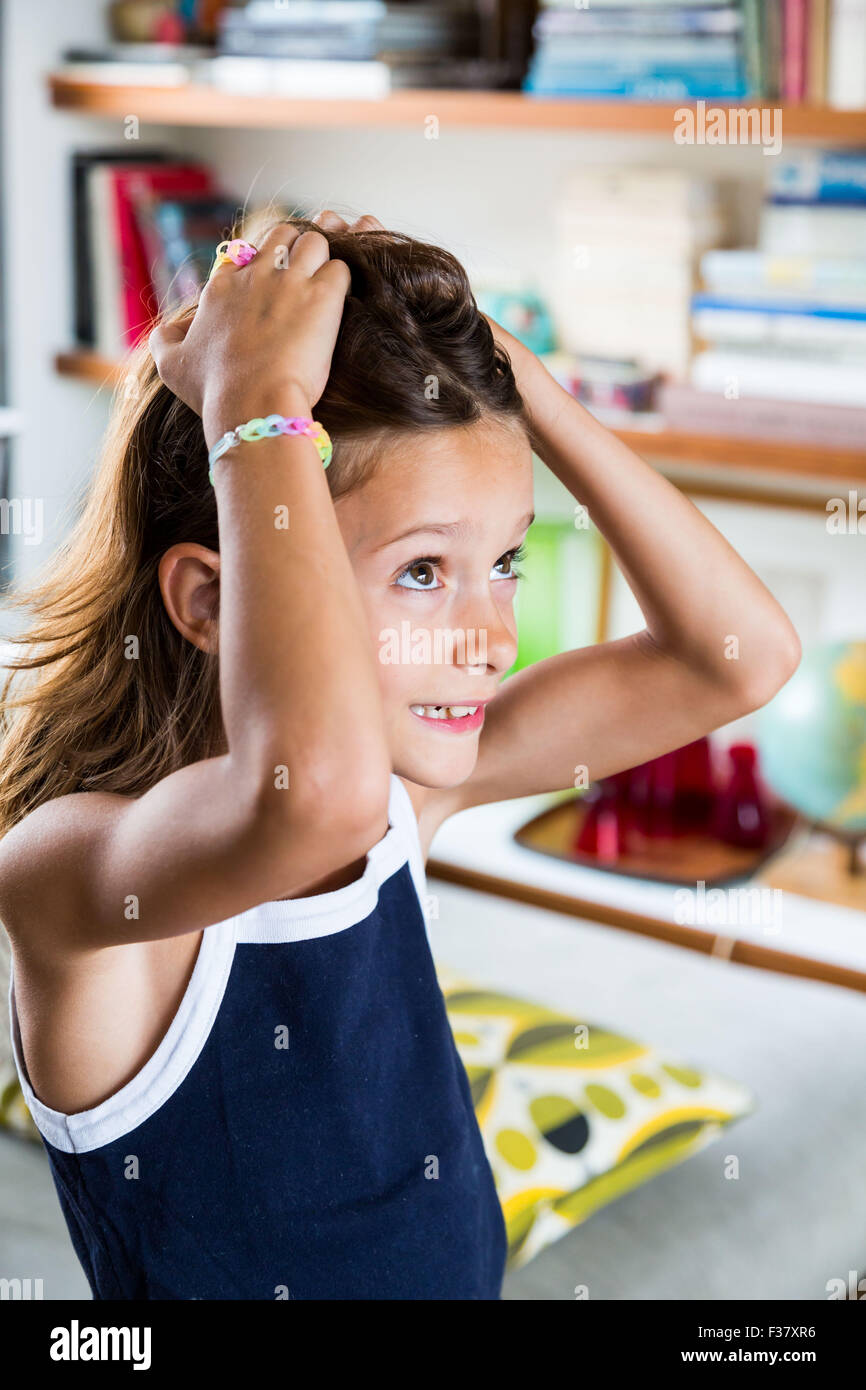 Girl scratching head Stock Photo - Alamy