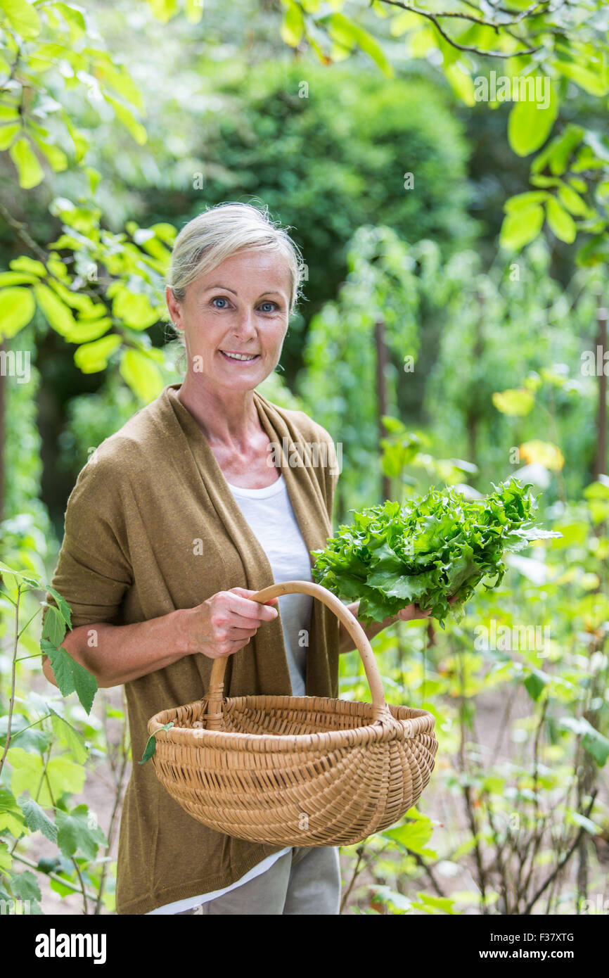 Woman gardening in her vegetable garden Stock Photo - Alamy