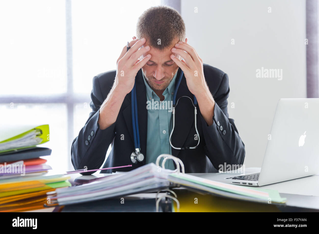 Doctor stressed gp hi-res stock photography and images - Alamy