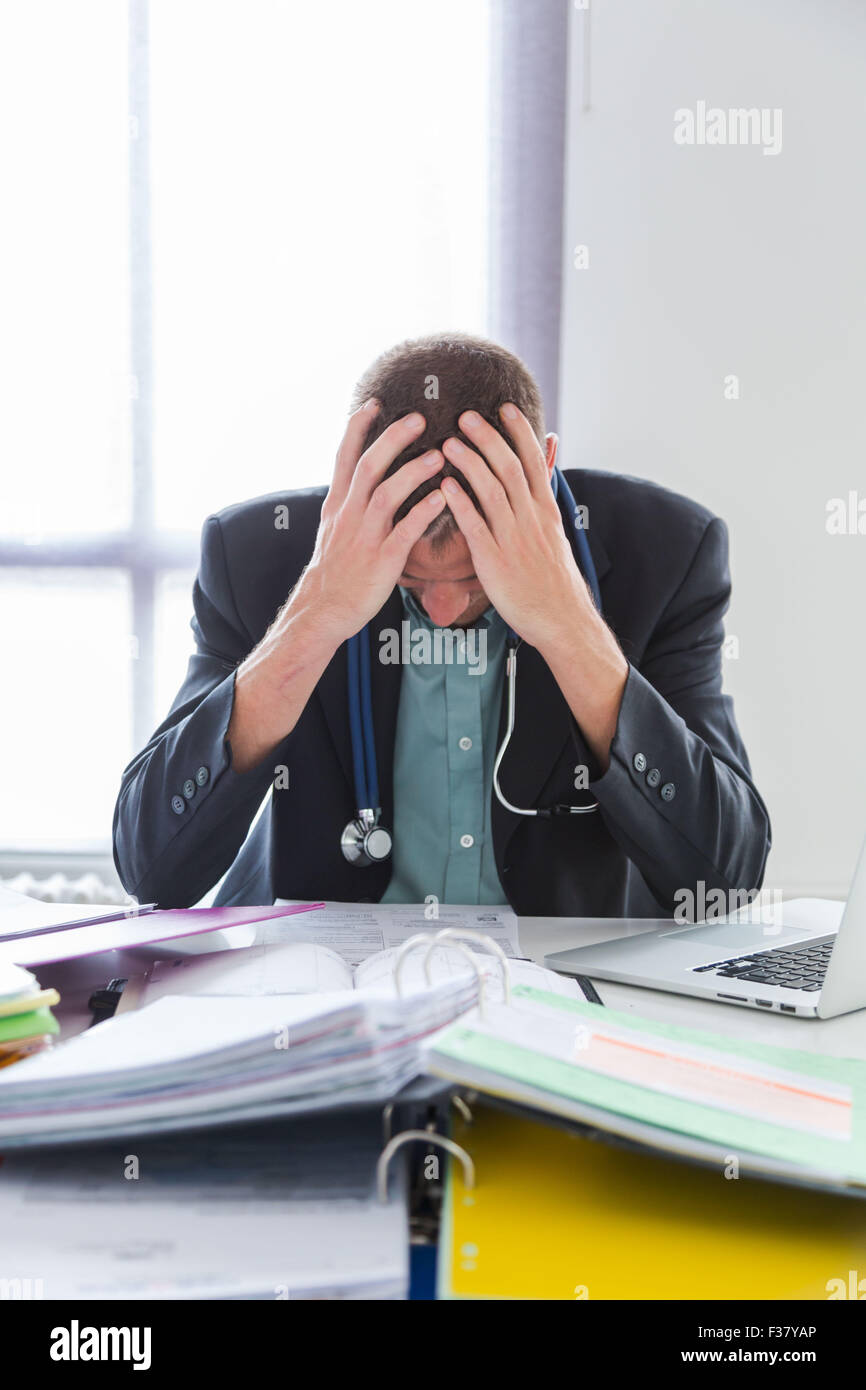 Doctor stressed gp hi-res stock photography and images - Alamy