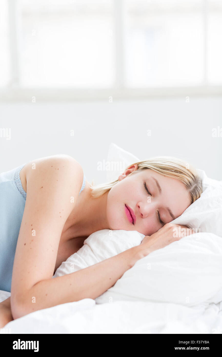 Woman in bed Stock Photo - Alamy