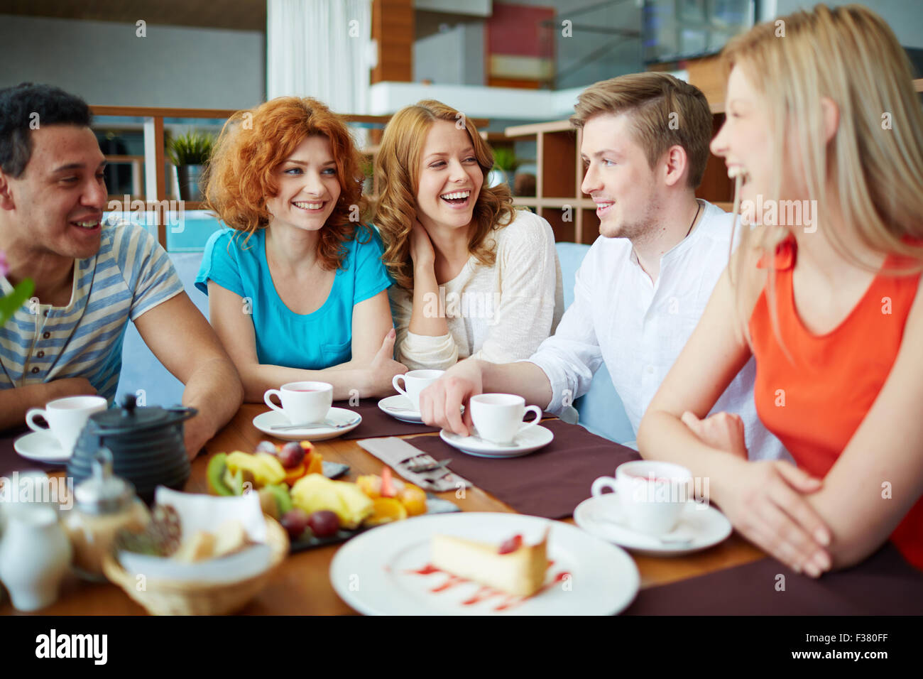 Happy girl relaxing in cafe hi-res stock photography and images - Alamy