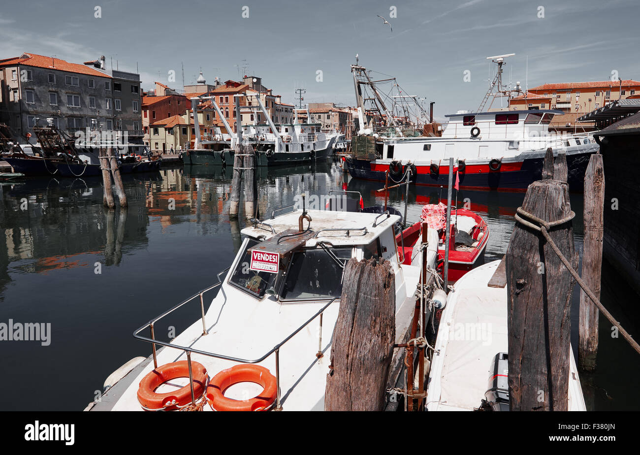 Boat for sale (vendesi) with fishing trawlers in background Chioggia ...