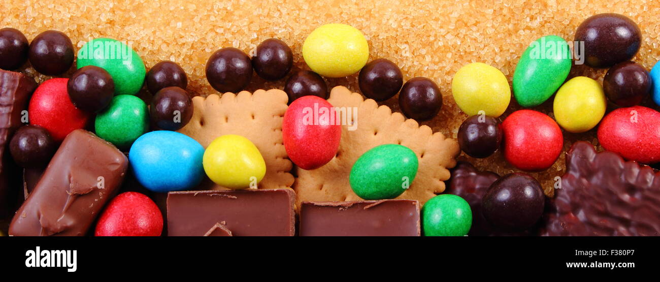 A lot of candies and cookies with brown cane sugar, too many sweets ...