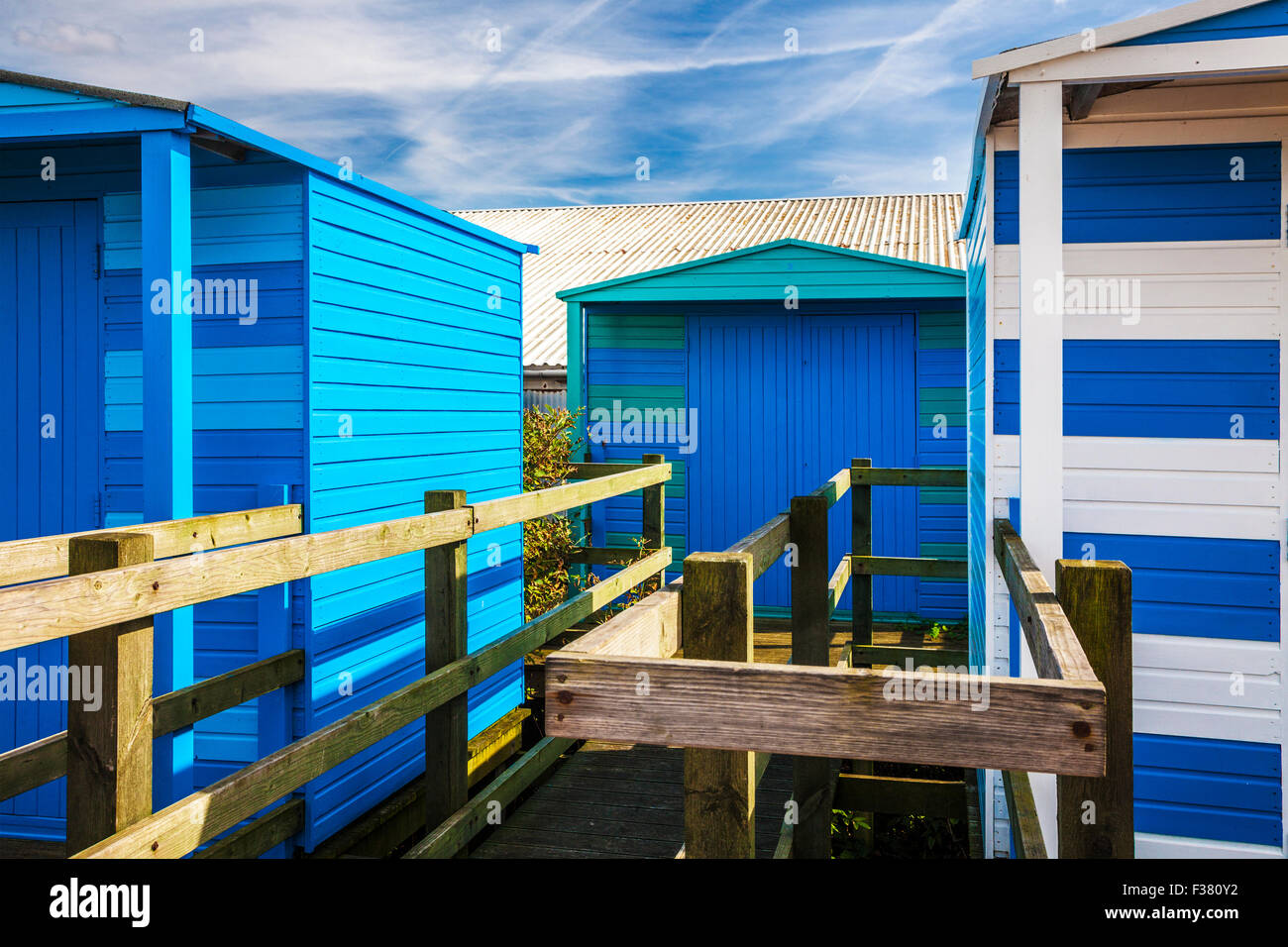 Colourful wooden beach huts in the Kentish coastal resort of Whitstable ...