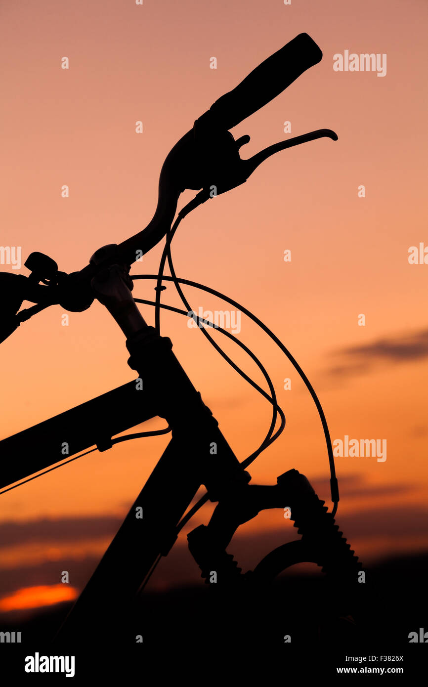 Bicycle at sunset Stock Photo - Alamy