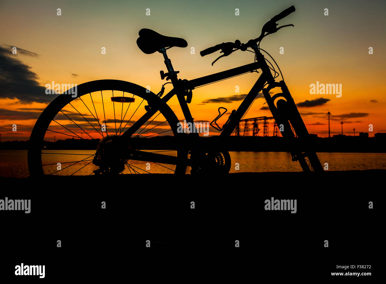 Bicycle at sunset Stock Photo - Alamy